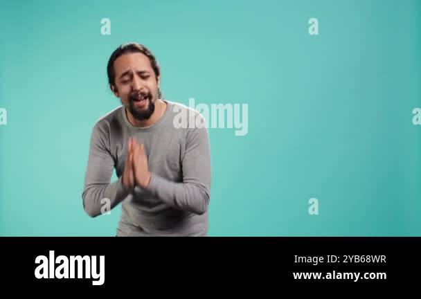 Man putting hands together in apology gesture, asking for forgiveness ...