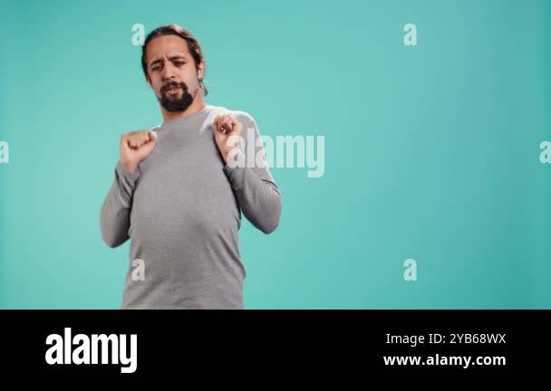 Portrait of man stretching his body, experiencing fatigue and tension ...