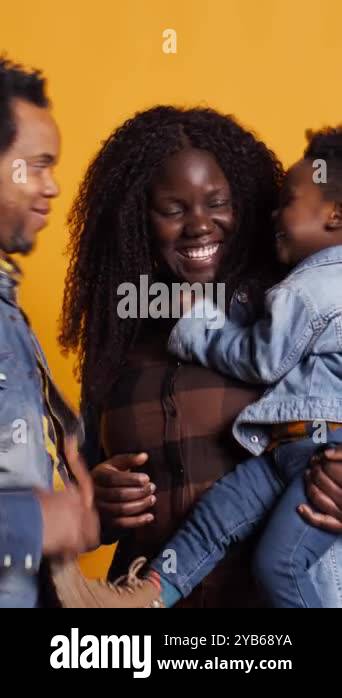 Vertical Video African american positive couple doing peek a boo with ...