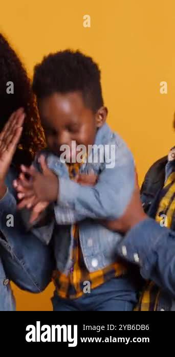 Vertical Video African american young couple clapping hands and dancing ...