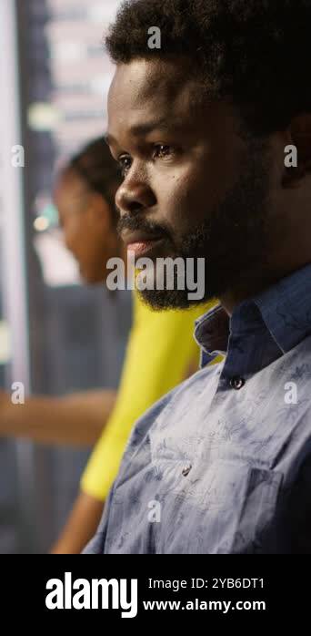 Vertical video System administrator at work creating machine learning models that can process ...