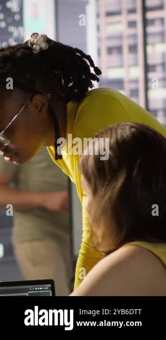 Vertical video Admin assisted by coworker while utilizing cloud computing resources to train ...