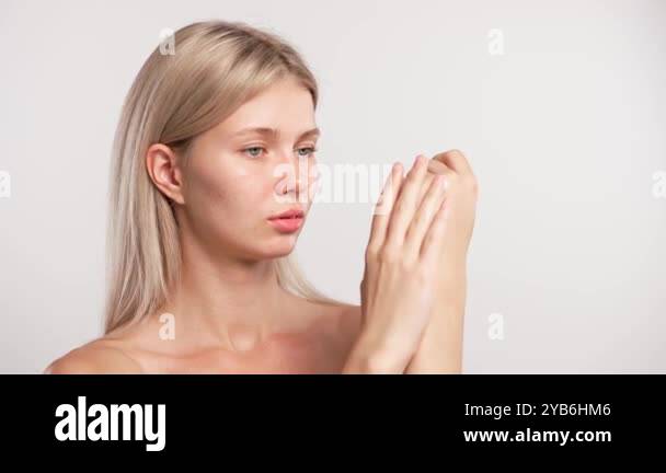 Attractive female model doing beauty treatment. Young blonde woman ...