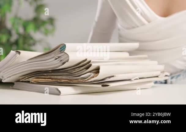 Female employee works with report papers. Woman puts on office desk ...