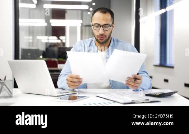 Confused puzzled african american businessman having difficulty with ...