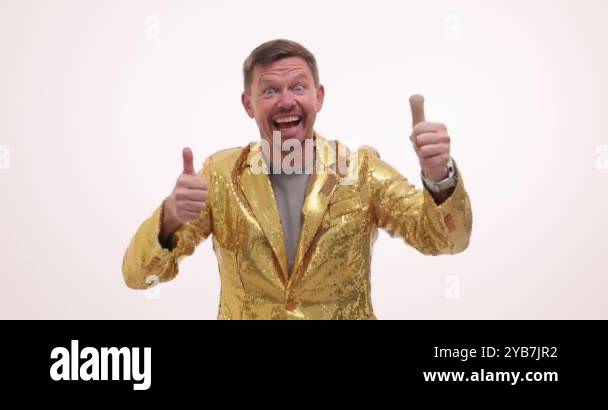 Man in golden jacket shows thumbs up gesture on white background ...