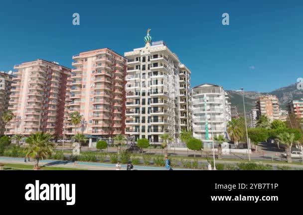 Watch 4K aerial footage of a beautiful white building on the beachfront ...