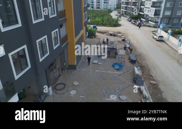 Enjoy stunning 4K aerial footage of facade construction on a high-rise ...