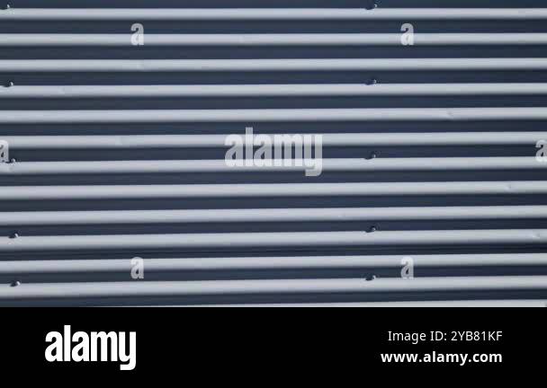 building is lined with square panels. metal sheet wall cladding with ...