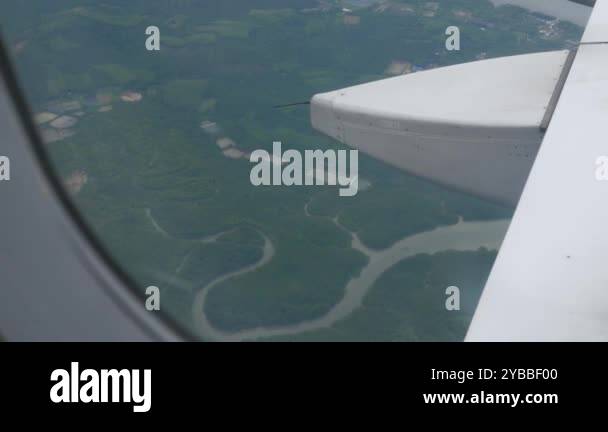 view through window of airplane while flying in sky from inside ...