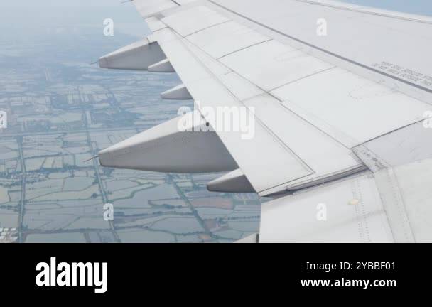 view through window of airplane while flying in sky from inside ...