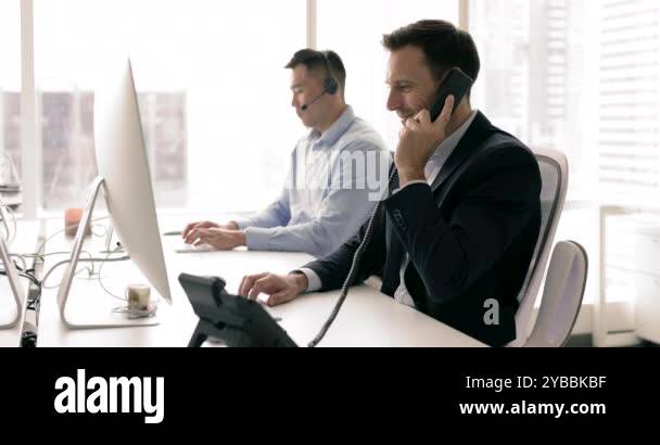 Workflow of helpline center agency, mature office employee sitting at ...