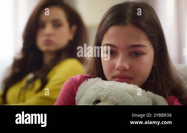 Upset scared sad Caucasian little girl sister crying child kid daughter ...