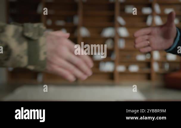 Close up male handshaking. Two unrecognizable men military soldier ...