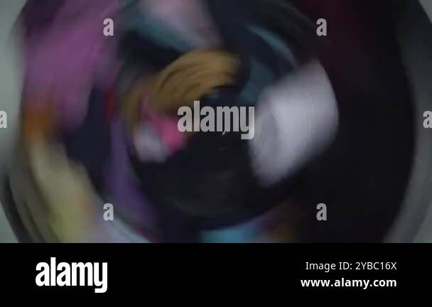 Process of washing and spinning clothes in a top loader washing machine ...