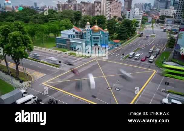Day time lapse clip of a busy intersection in Singapore with the Masjid ...