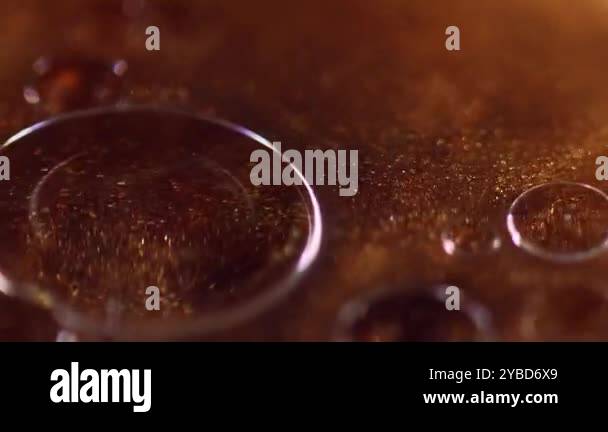 Gel emulsion. Oil fluid. Defocused bronze golden color transparent ...