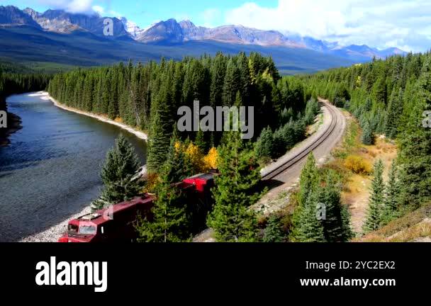 Train passing famous Morant's curve at Bow Valley in autumn ,Banff National Park, Canadian ...
