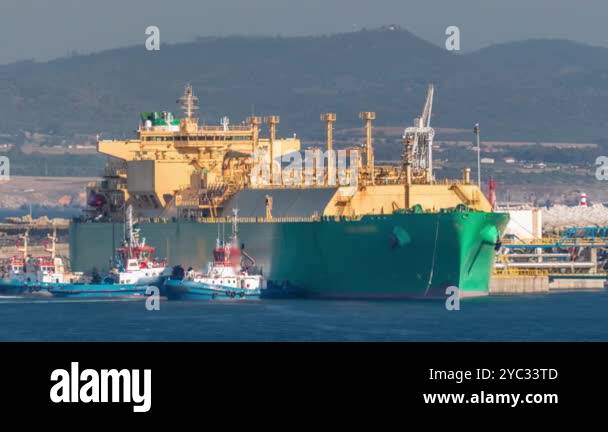 LNG Liquified Natural Gas tanker anchored in port terminal timelapse ...