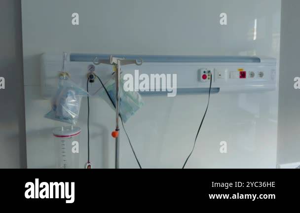 Hospital bed with IV drip attached to stand. Oxygen mask ready for next ...