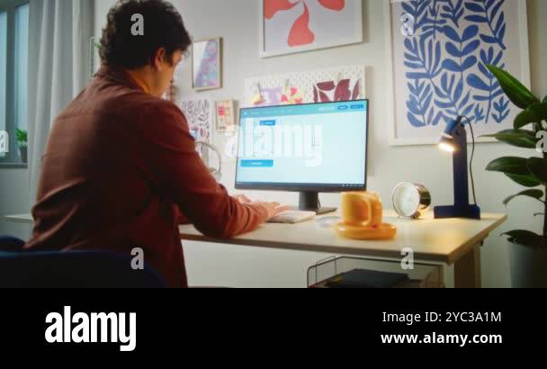 Young man types text prompt in AI video generator on computer. PC ...