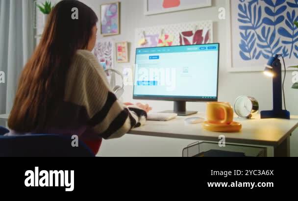 Back view of girl typing prompt in AI video generator on PC. Artificial ...