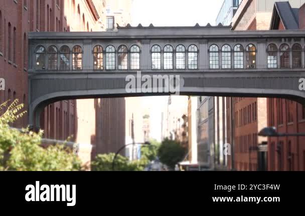 New York City street, Chelsea Market skybridge. Retro industrial ...