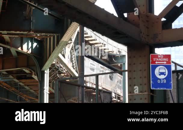 New York elevated subway, metropolitan bridge, metro track above street ...