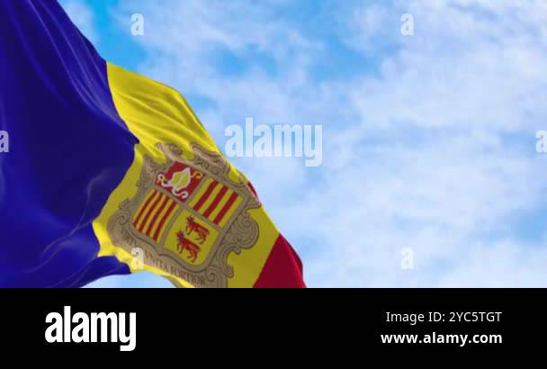 Flag of the Principality of Andorra waving in the wind on a clear day ...