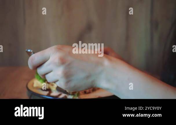 A serene moment of mindful eating as a woman enjoys her healthy meal at ...
