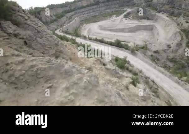 This 4K aerial video showcases a limestone quarry from a birds eye view ...