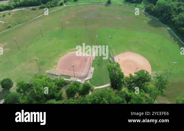 Baseball fields grassy lawn, LED light poles, cage batting tunnel and ...