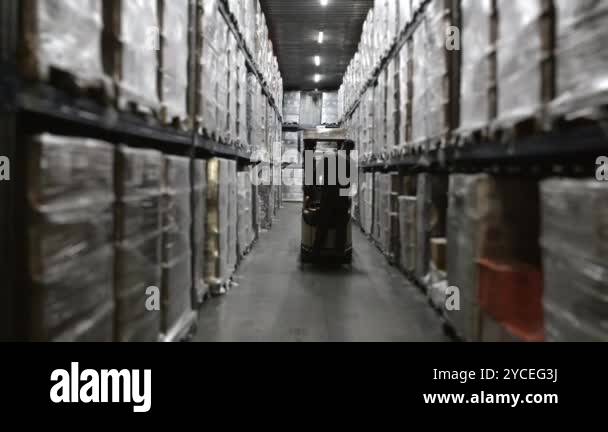 Forklift operation in a modern warehouse of finished products and raw ... Forklift operation in a modern warehouse of finished products and raw ...