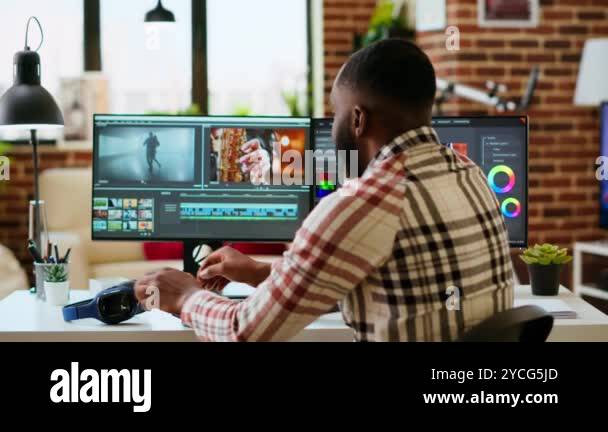 African american filmmaker man works on a professional video shoot ...