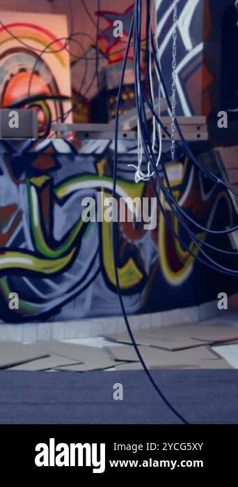 Vertical video Desolate headquarters used by gang members with graffiti ...