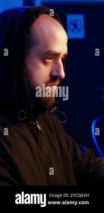 Vertical video Hacker hiding in underground bunker excited after ...