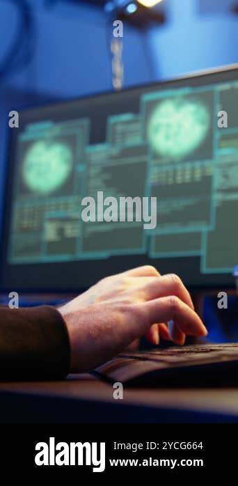 Vertical video Hackers typing fast on keyboard in graffiti painted ...