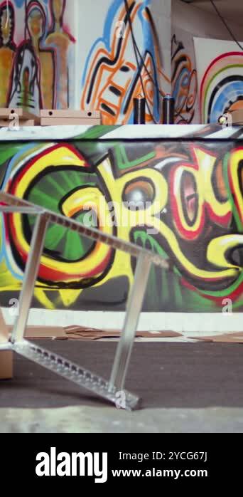 Vertical video Empty vandalized property with graffiti paintings on ...
