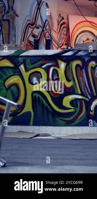 Vertical video Empty destroyed infrastructure with graffiti street art ...