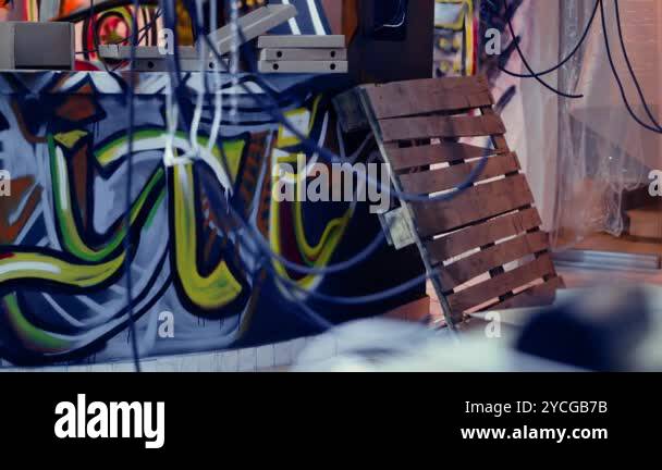 Empty pizza boxes in damaged abandoned warehouse with graffiti drawings ...