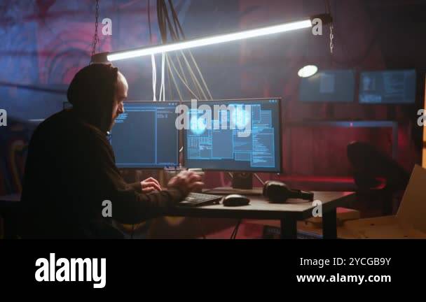 Hacker Using High Tech Computer System To Run Malicious Code In Foggy 0031