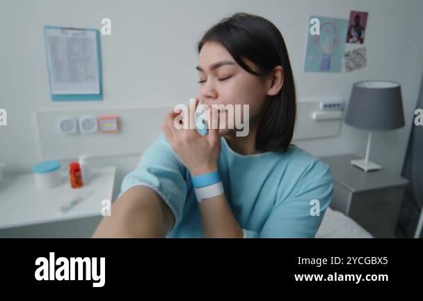 Young female patient showing her nose after plastic surgery and talking ...