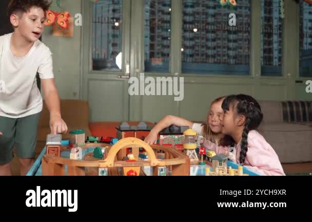 Multicultural girl playing toy to improve and develop creativity ...