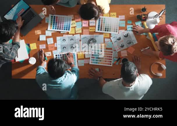 Top down view of designer compare color palettes with laptop and design ...