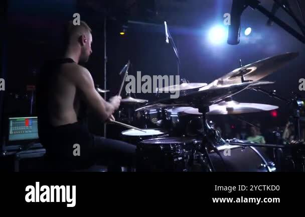 The drummer cool plays the rock concert. The drummer beats the drums on ...