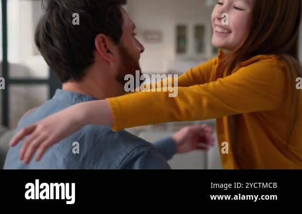 Happy cheerful Caucasian little child girl daughter hugging cuddling ...