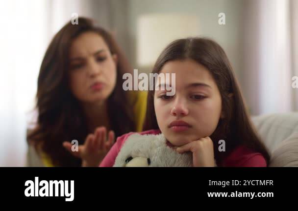 Angry furious Caucasian woman female shouting mother mom yelling parent argument quarrel ...