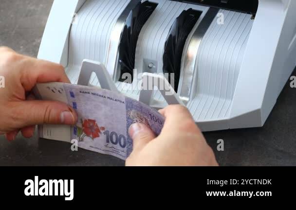 Malaysian Ringgit. Counting Malaysian money in banknote counting ...