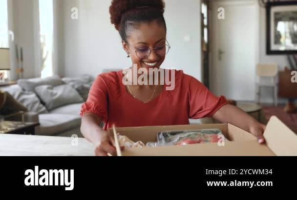 Young woman received order from grocery store unpack fresh products ...