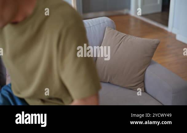Closeup brunette falling couch feeling relaxed at home. Exhausted lazy ...